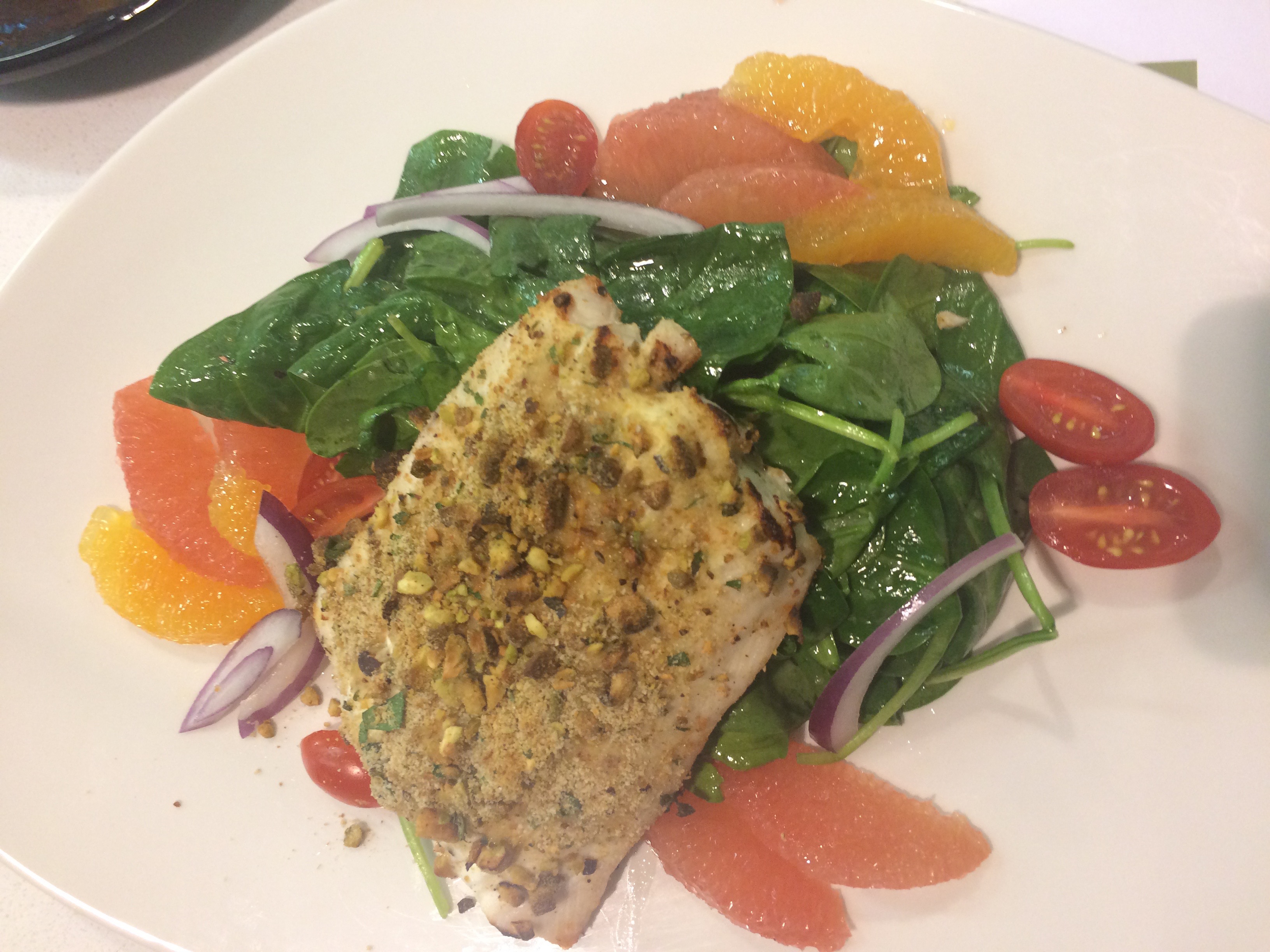 Chef rolls out his pistachio-crusted whitefish for an appreciative ...
